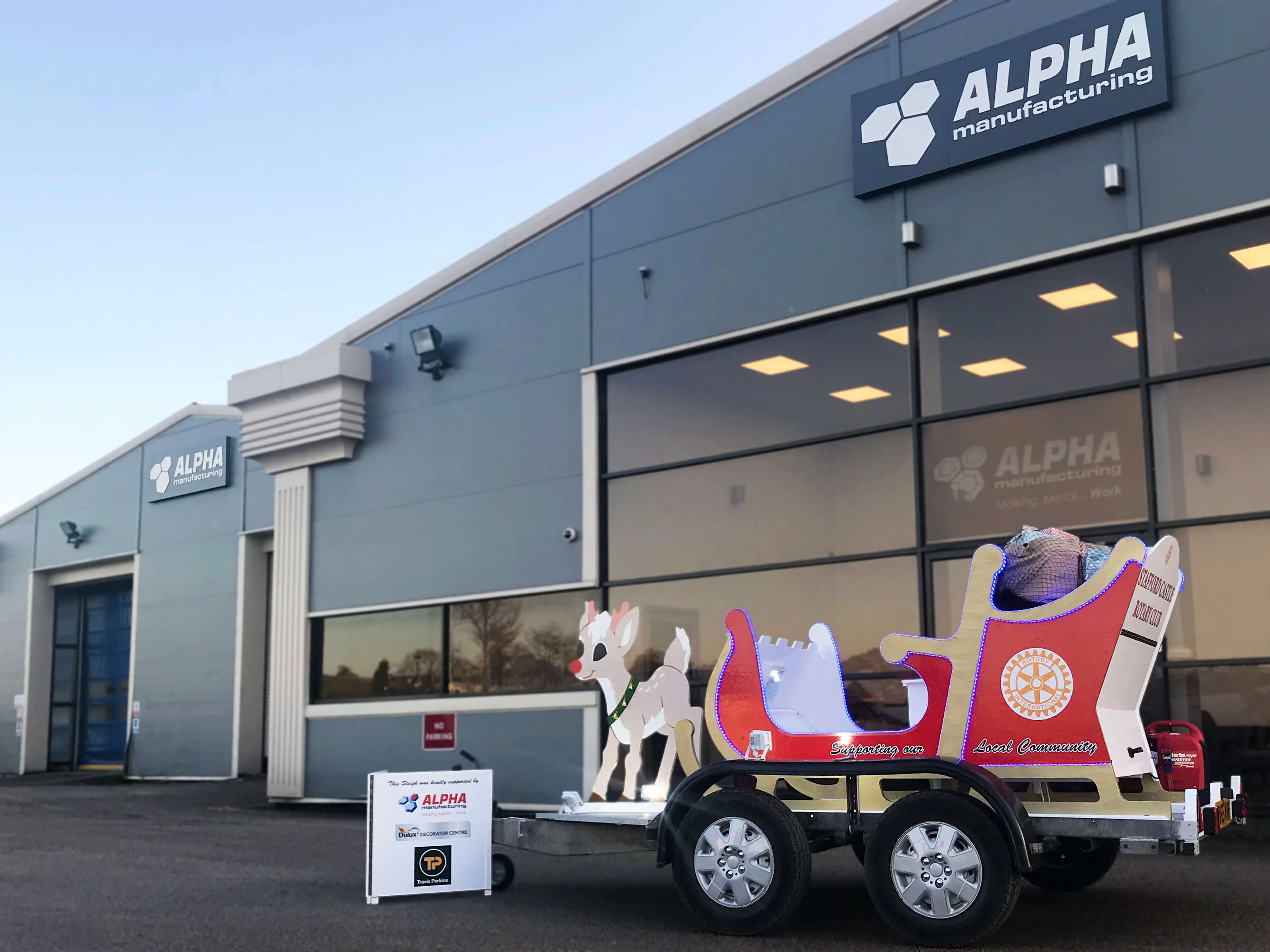 Alpha Supporting Santa With New Sleigh - Alpha Manufacturing